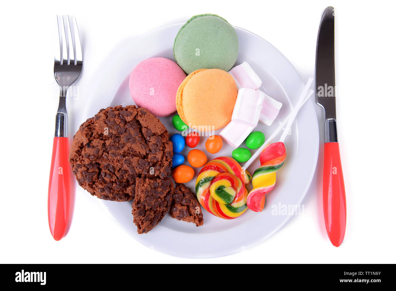 Different sweets on plate isolated on white Stock Photo - Alamy