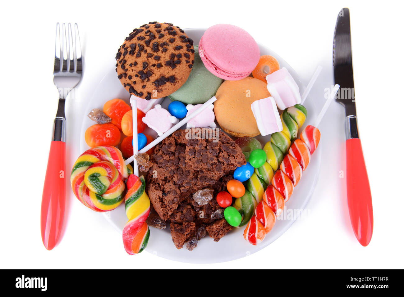 Different sweets on plate isolated on white Stock Photo - Alamy