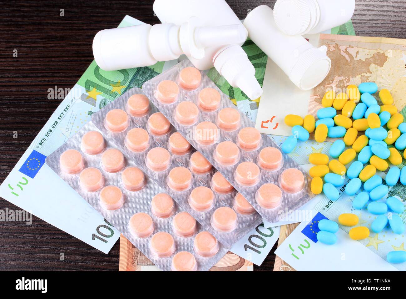 Prescription drugs on money background representing rising health care ...