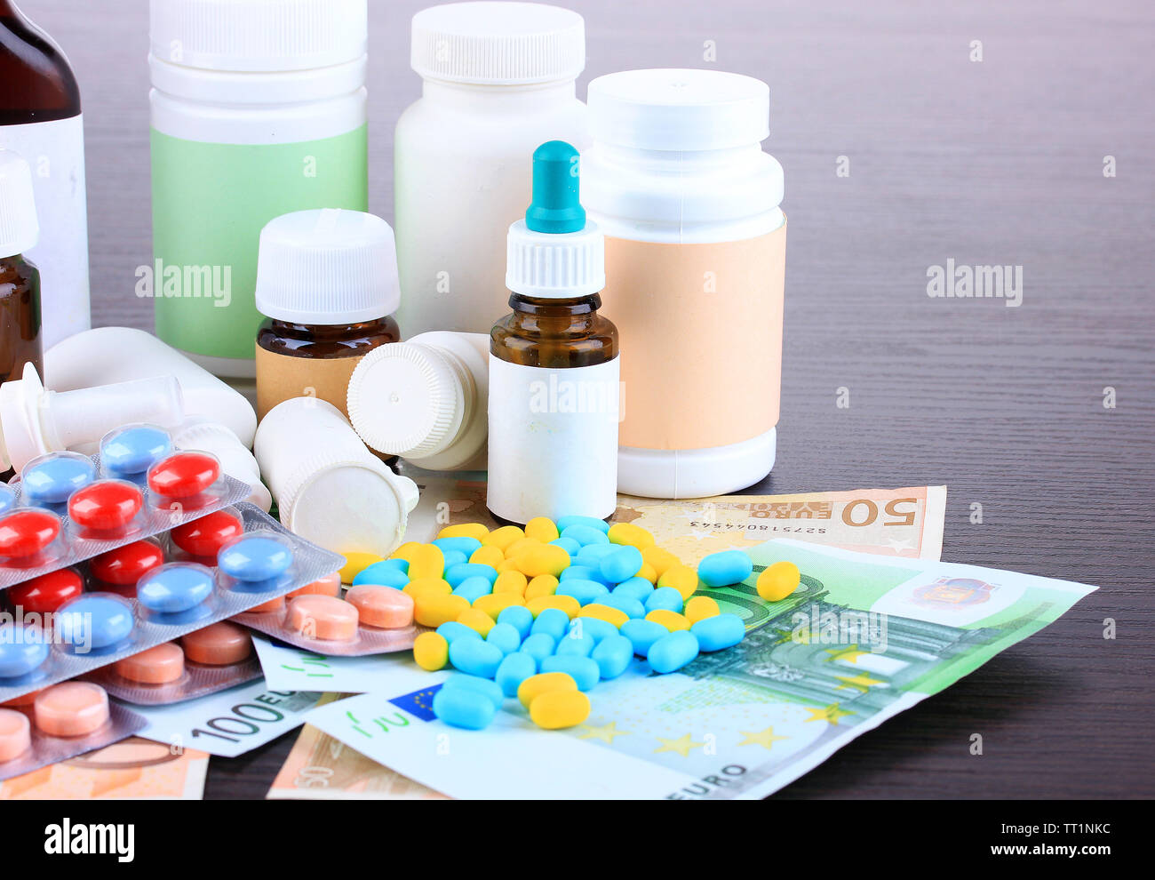 Prescription drugs on money background representing rising health care ...