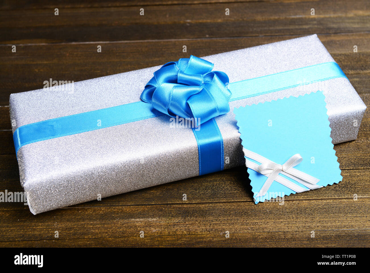 Gift box on table close-up Stock Photo - Alamy