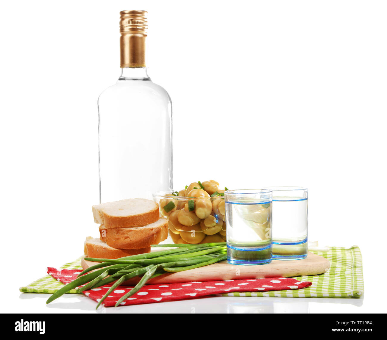 Composition with bottle of vodka and marinated mushrooms, cucumbers on ...