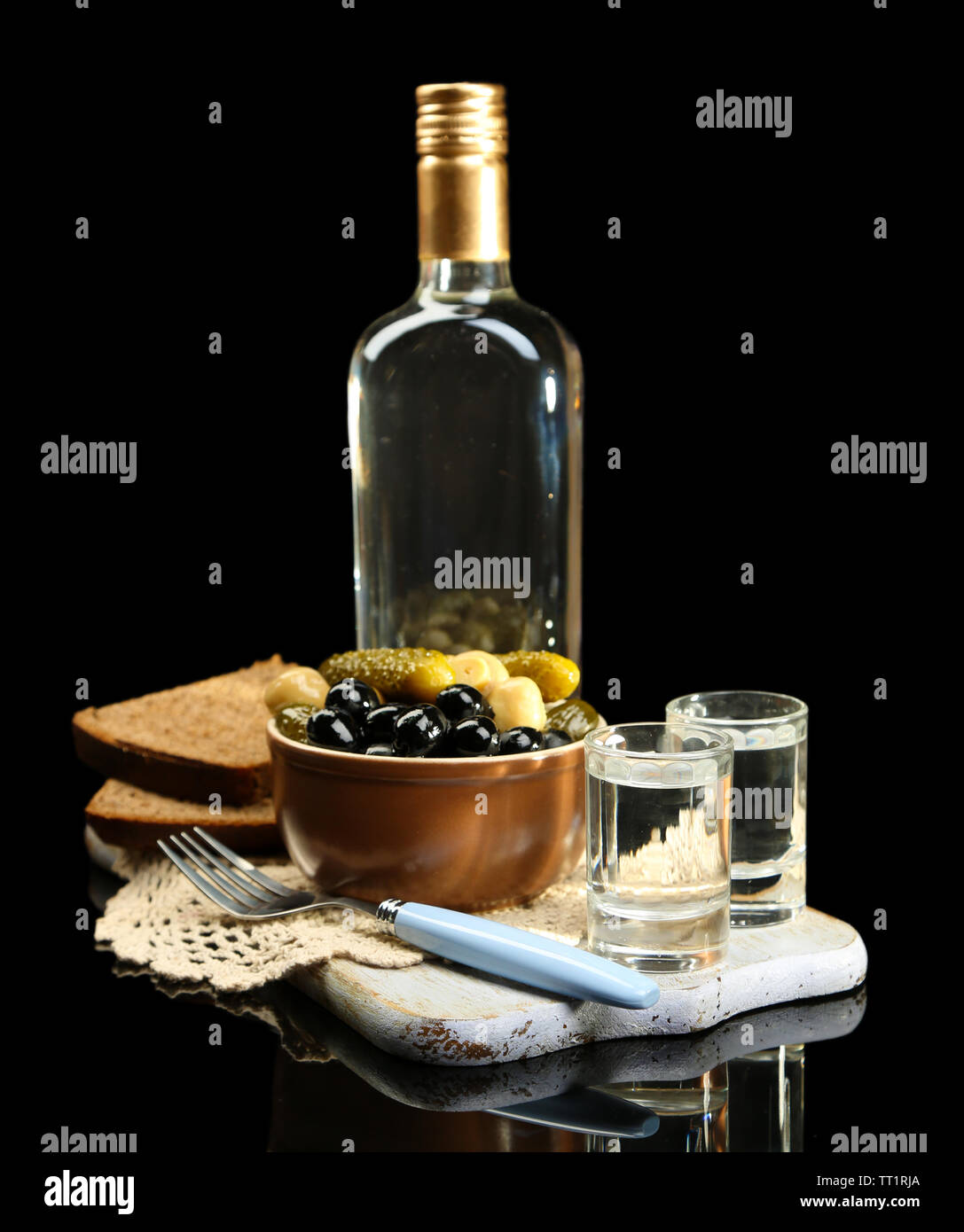 Composition with bottle of vodka, and marinated vegetables, fresh bread ...
