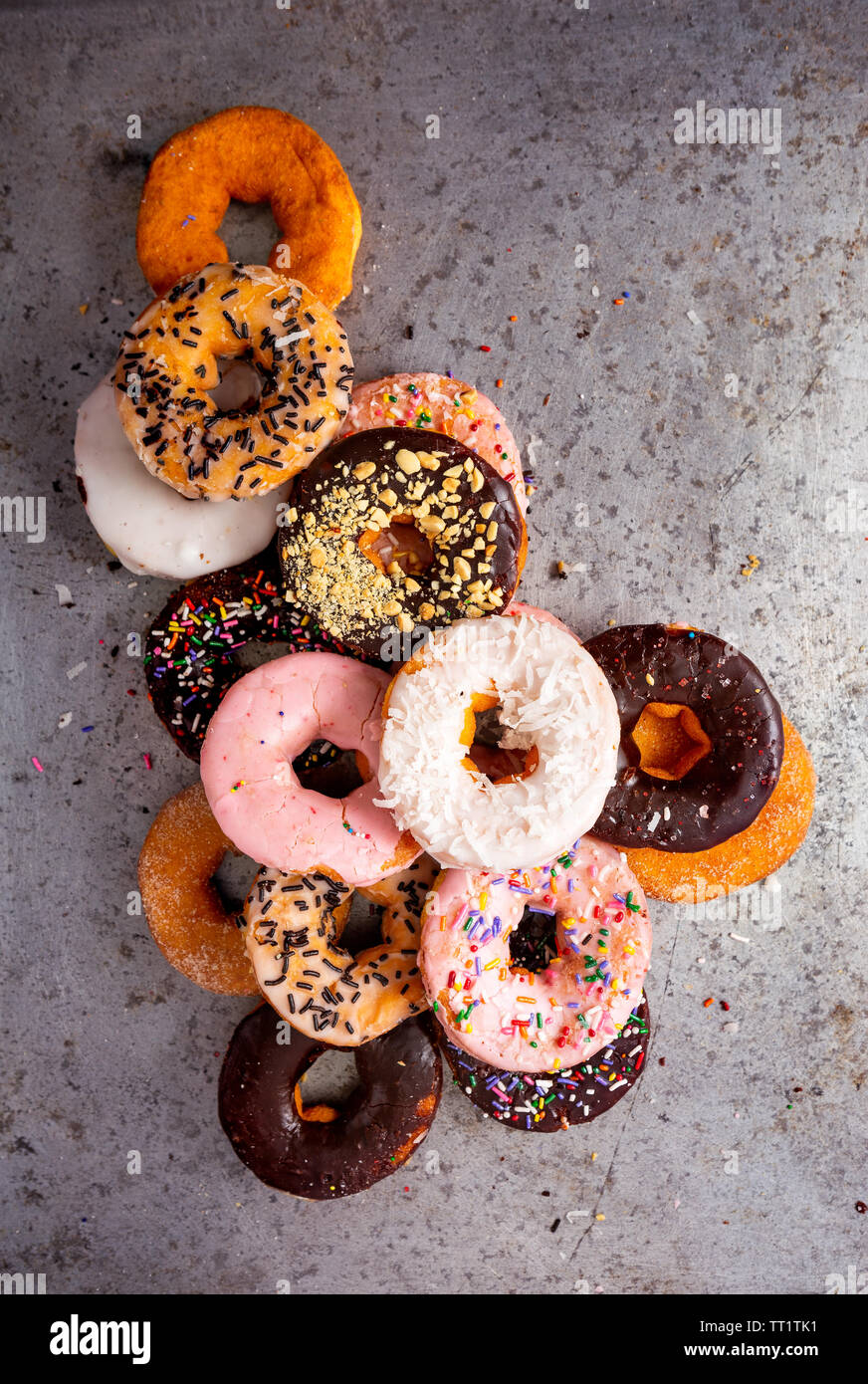 Overhead view of a dozen freshly baked doughnuts Stock Photo - Alamy