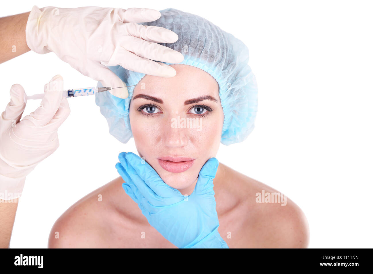 Woman in beauty clinic getting botox injection, isolated on white Stock ...
