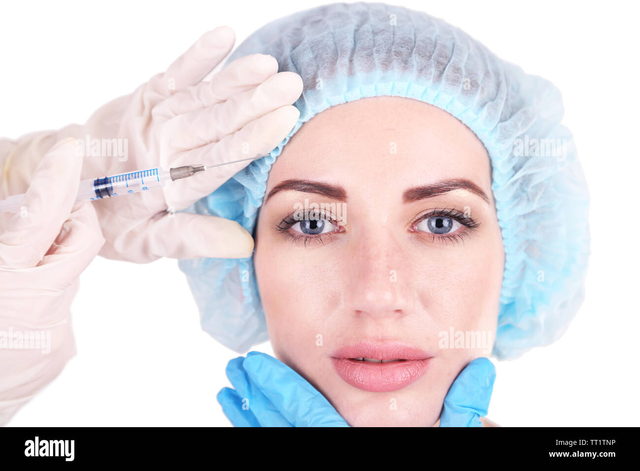 Woman in beauty clinic getting botox injection, isolated on white Stock ...