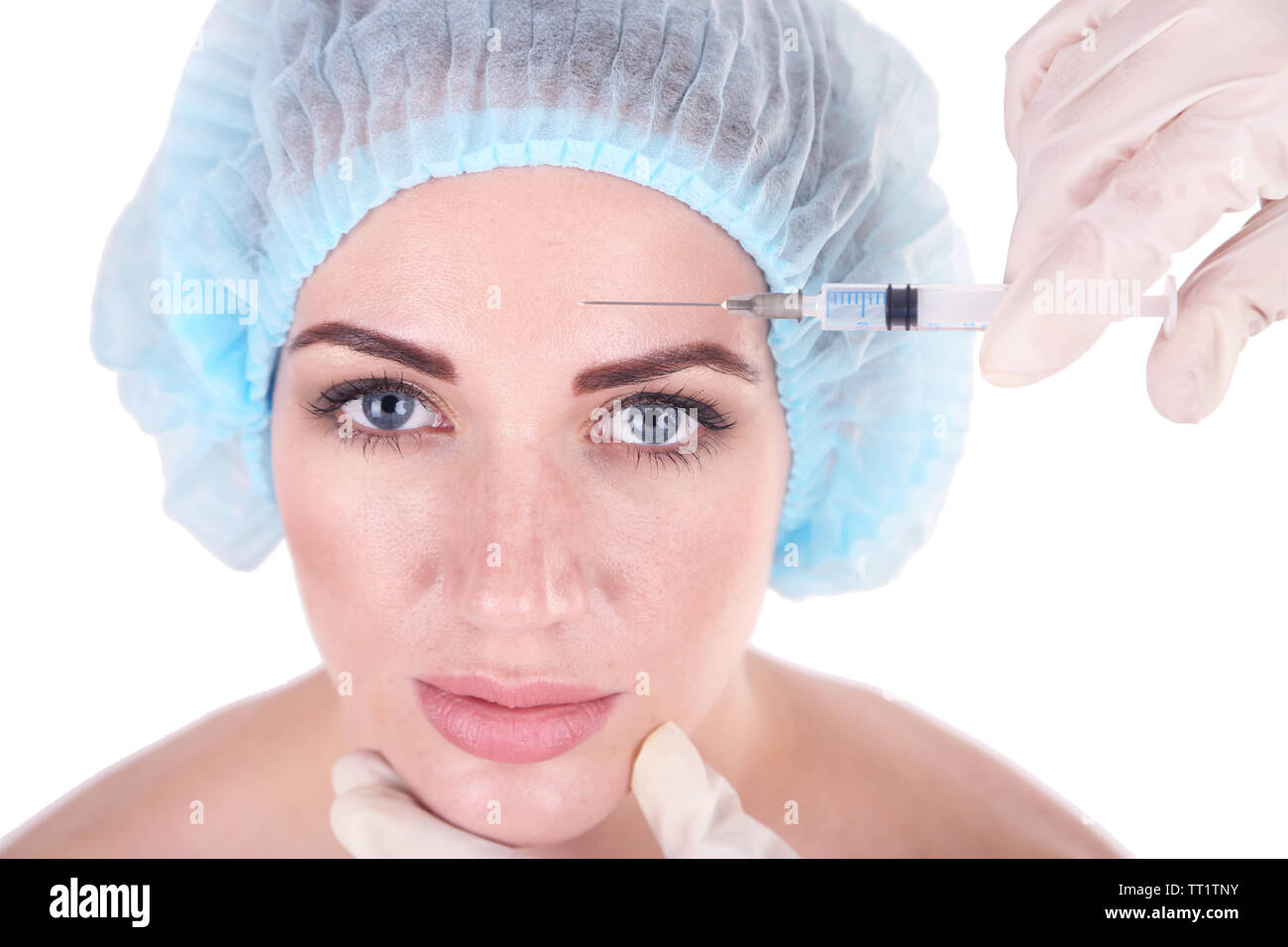 Woman in beauty clinic getting botox injection, isolated on white Stock ...
