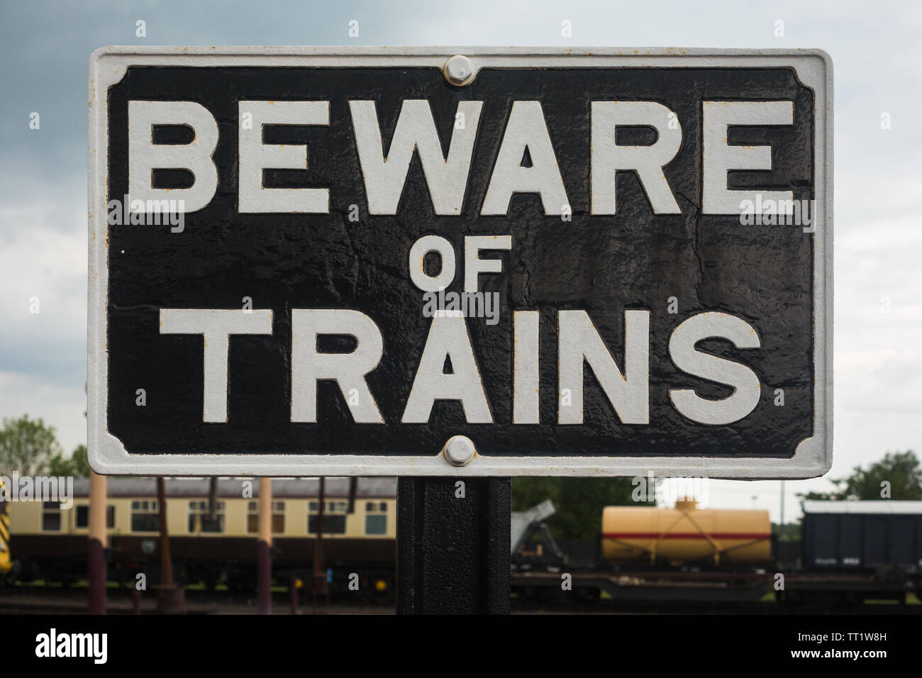 Prominent old rectangular metal silver and black "Beware of Trains ...