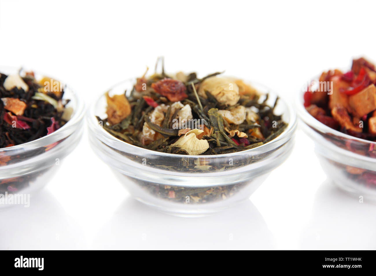 Different kinds of dry tea in bowls isolated on white Stock Photo - Alamy