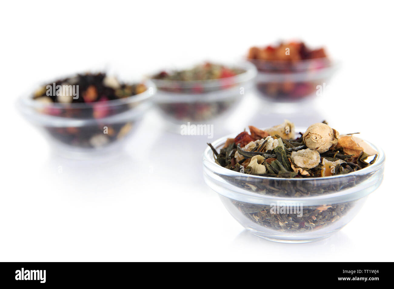 Different kinds of dry tea in bowls isolated on white Stock Photo - Alamy