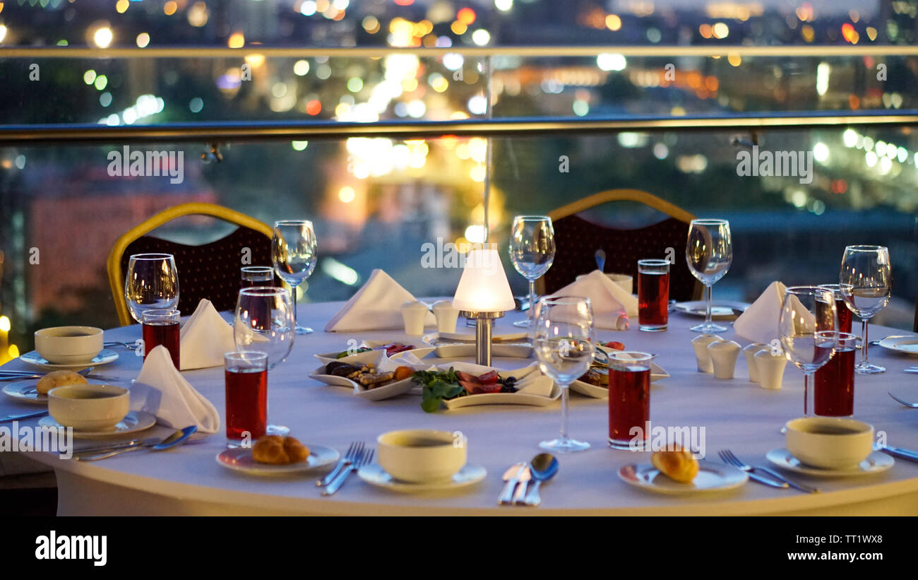 fancy sunset table on roof tea time Stock Photo - Alamy