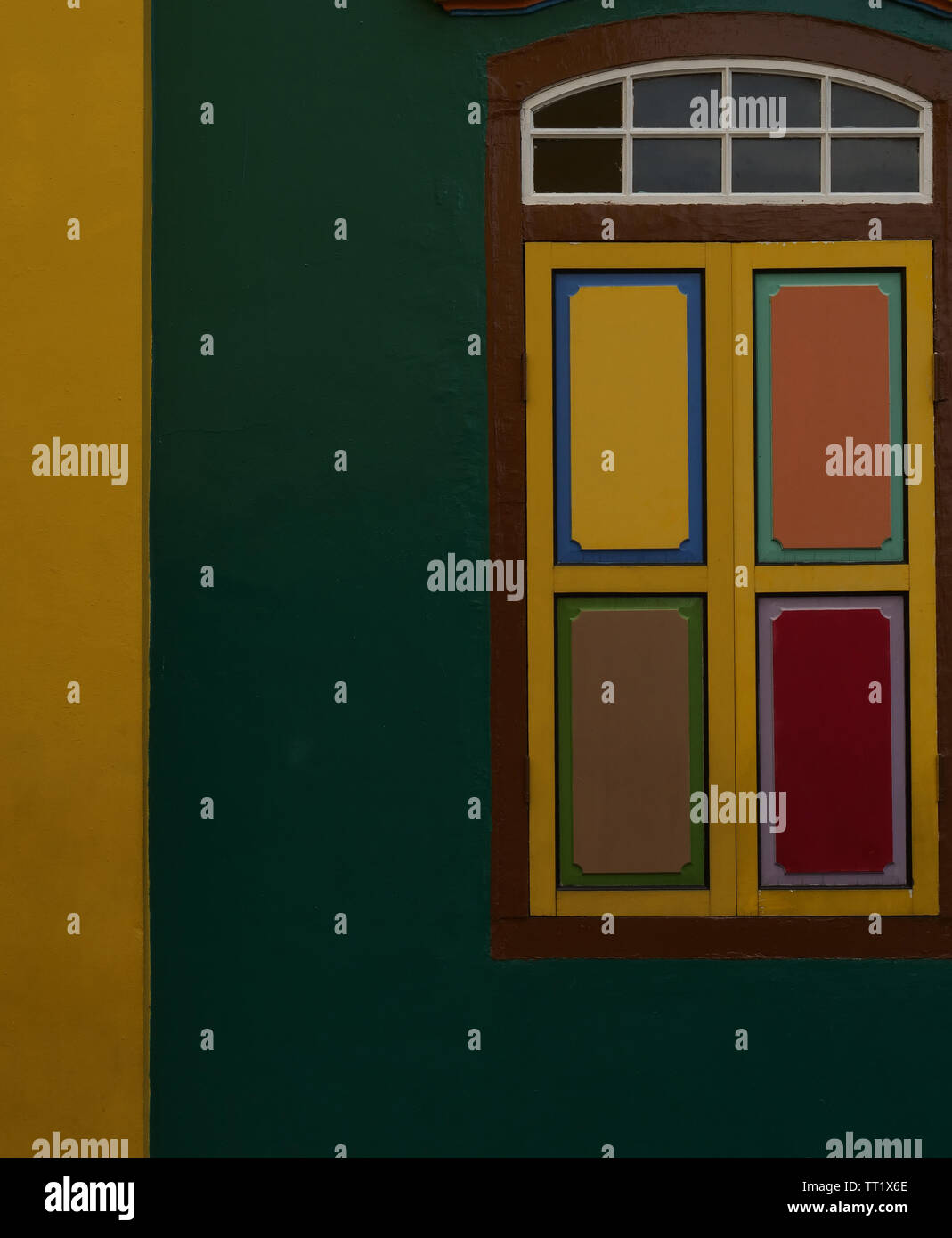 Bright coloured shapes on houses in Singapore Stock Photo - Alamy