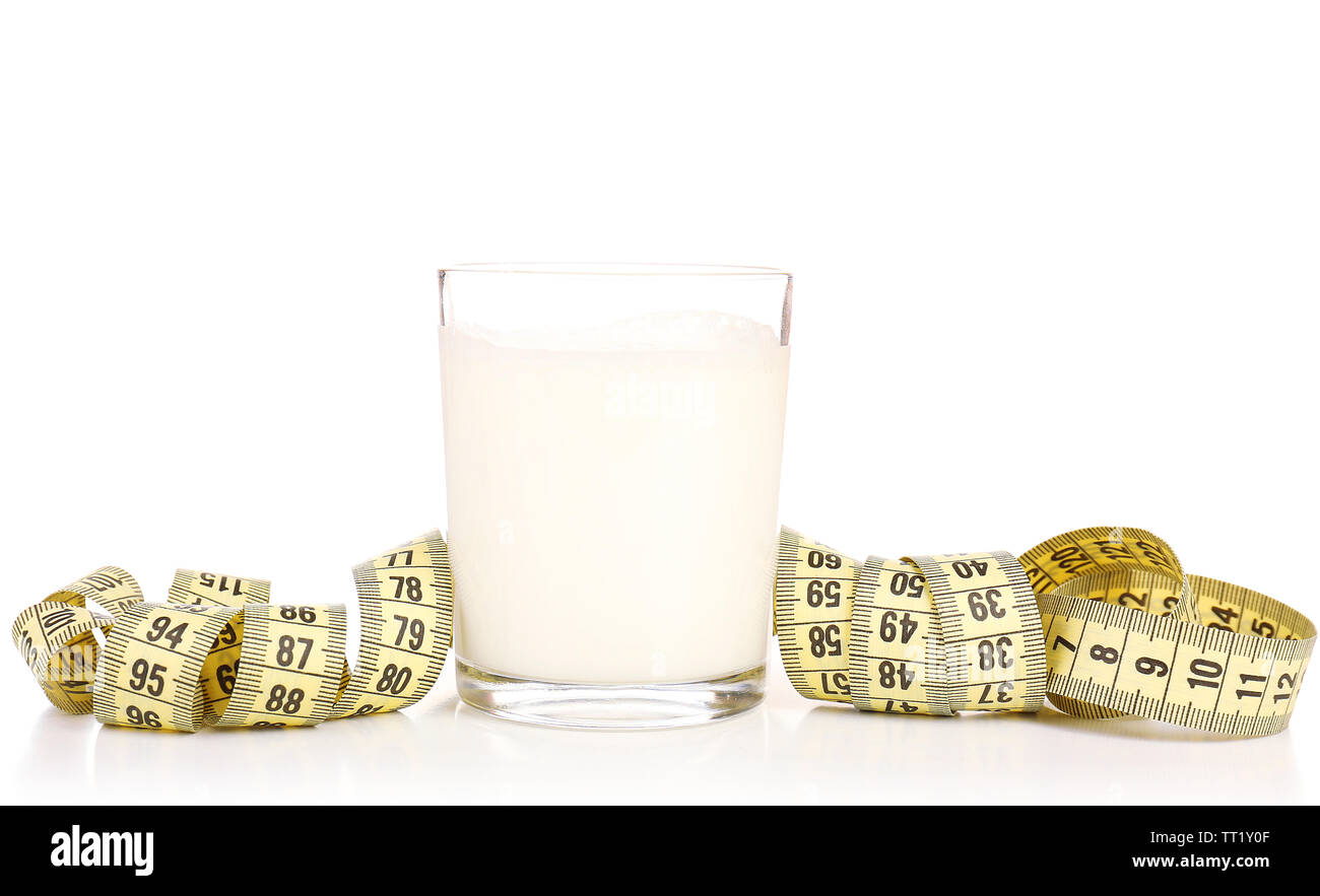 Glass of milk with measuring tape isolated on white Stock Photo - Alamy