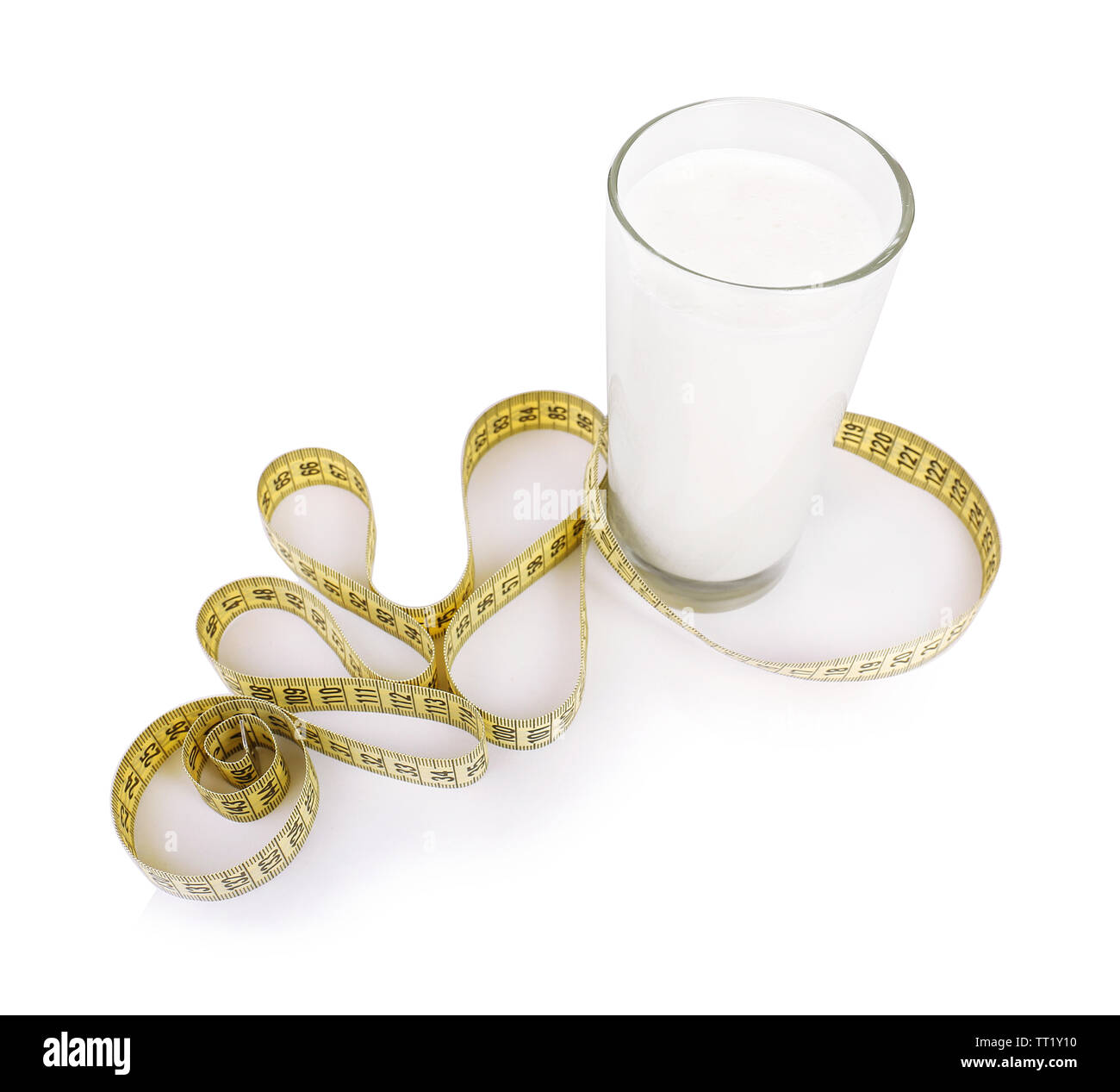 Glass of milk with measuring tape isolated on white Stock Photo - Alamy