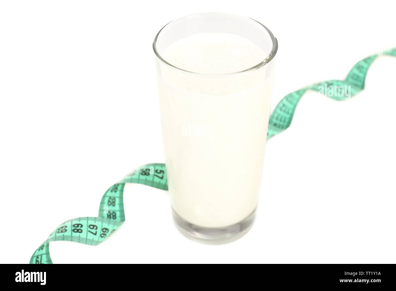 Glass of milk with measuring tape isolated on white Stock Photo - Alamy