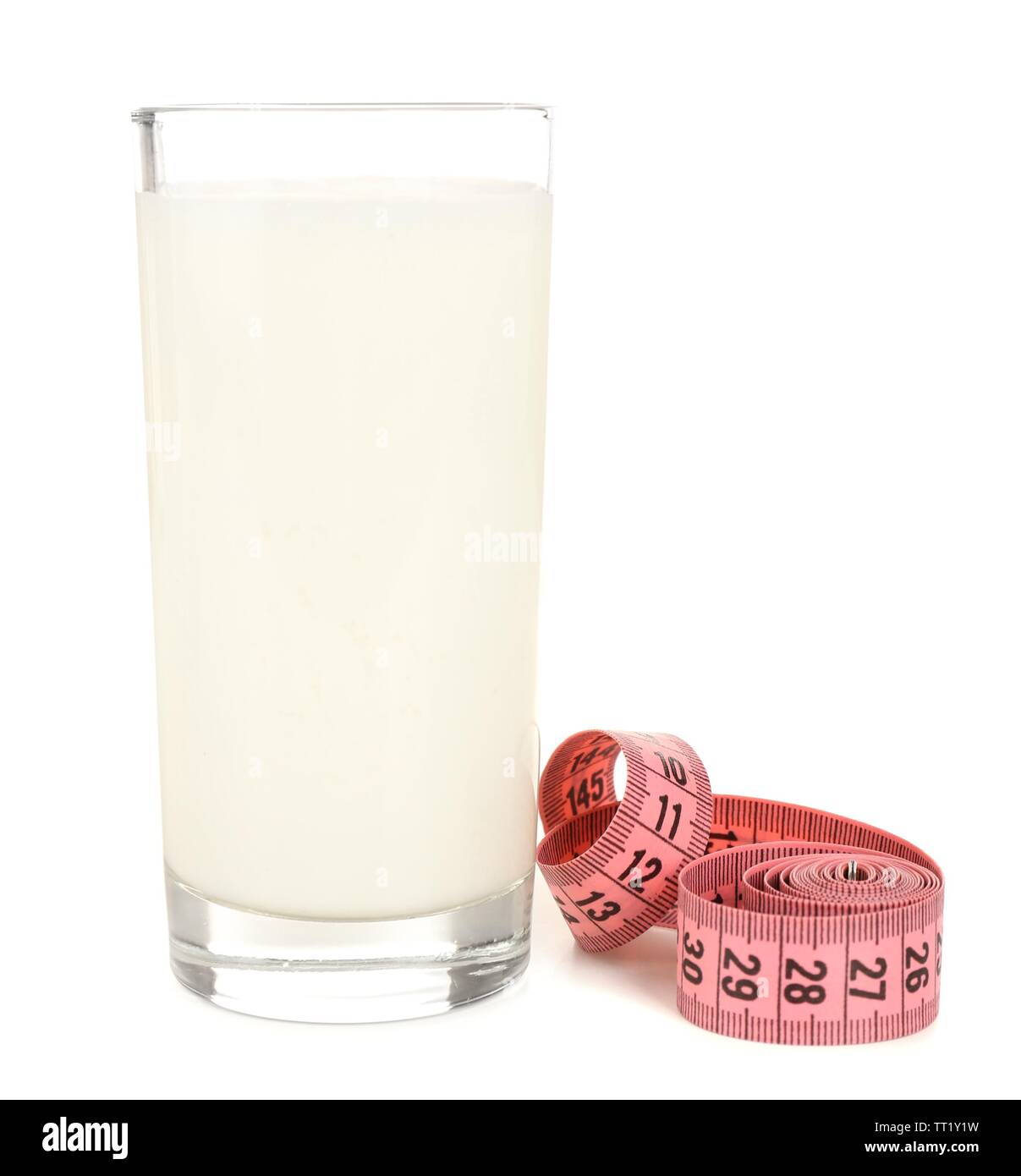 Glass of milk with measuring tape isolated on white Stock Photo - Alamy