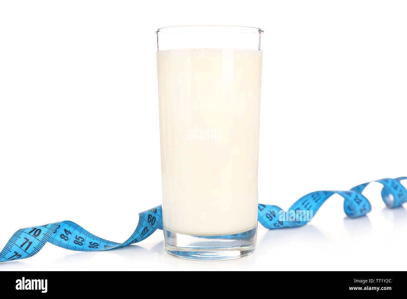 Glass of milk with measuring tape isolated on white Stock Photo - Alamy