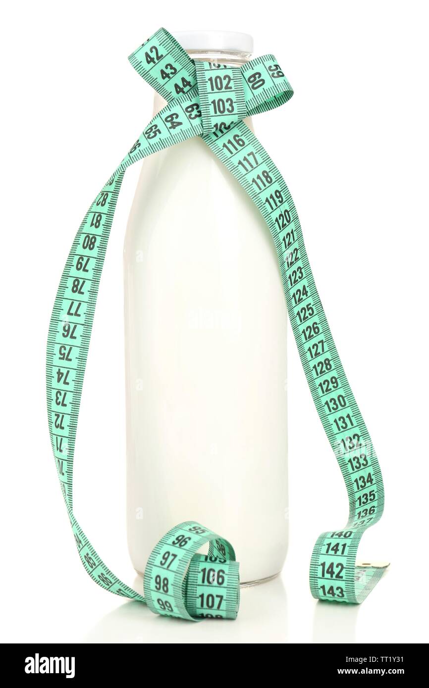 Bottle of milk with measuring tape isolated on white Stock Photo - Alamy