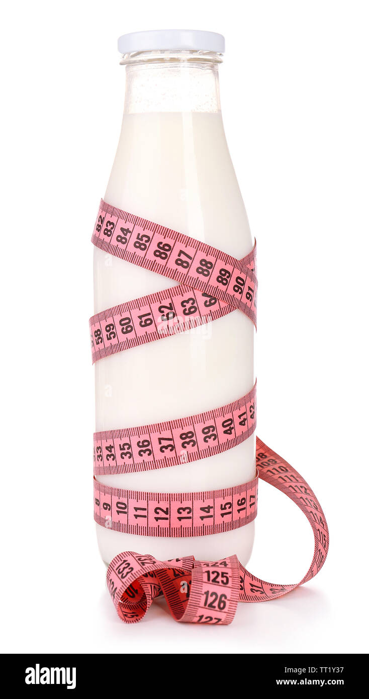 Bottle of milk with measuring tape isolated on white Stock Photo - Alamy