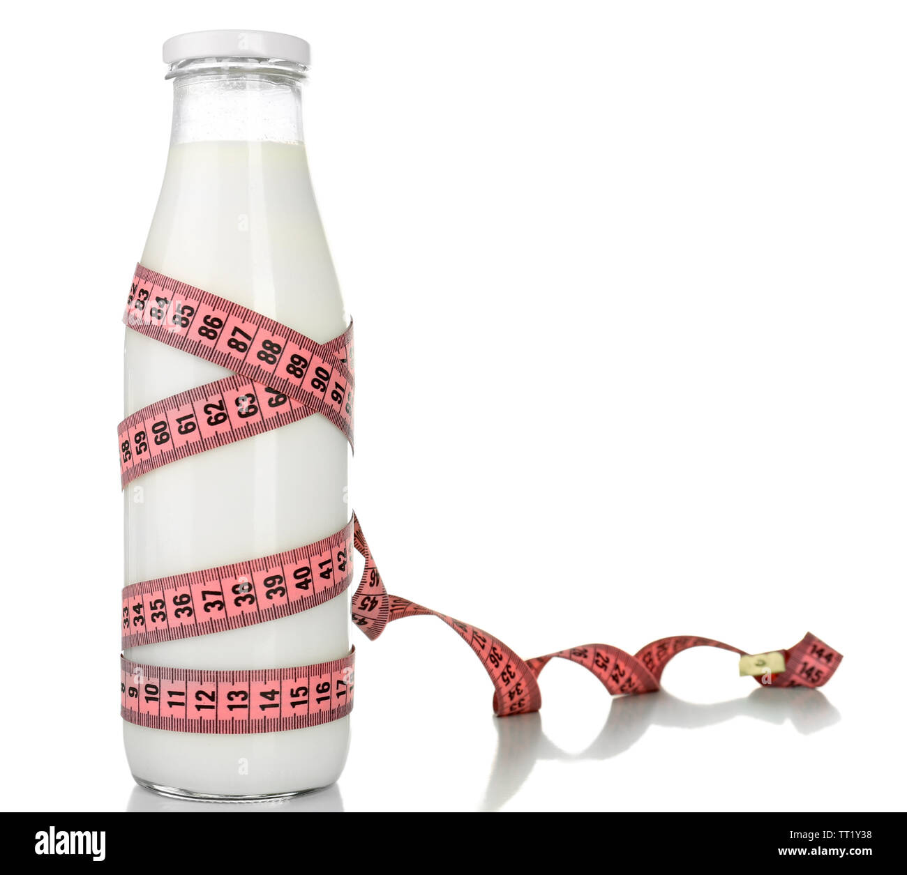Bottle of milk with measuring tape isolated on white Stock Photo - Alamy