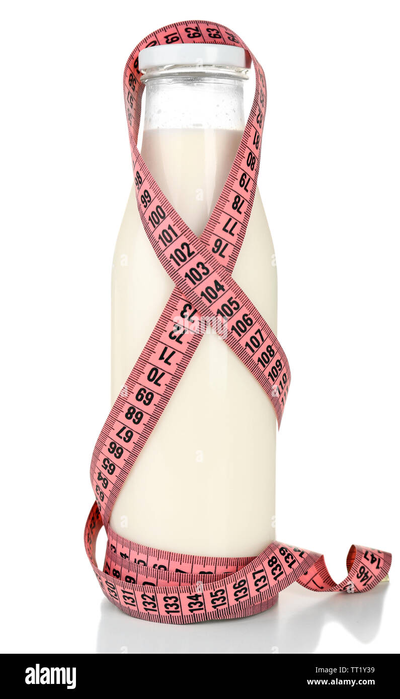Bottle of milk with measuring tape isolated on white Stock Photo - Alamy