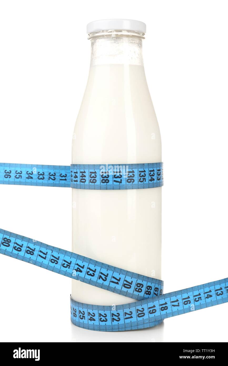 Bottle of milk with measuring tape isolated on white Stock Photo - Alamy