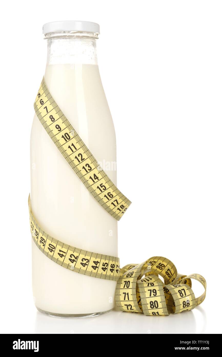 Bottle of milk with measuring tape isolated on white Stock Photo - Alamy