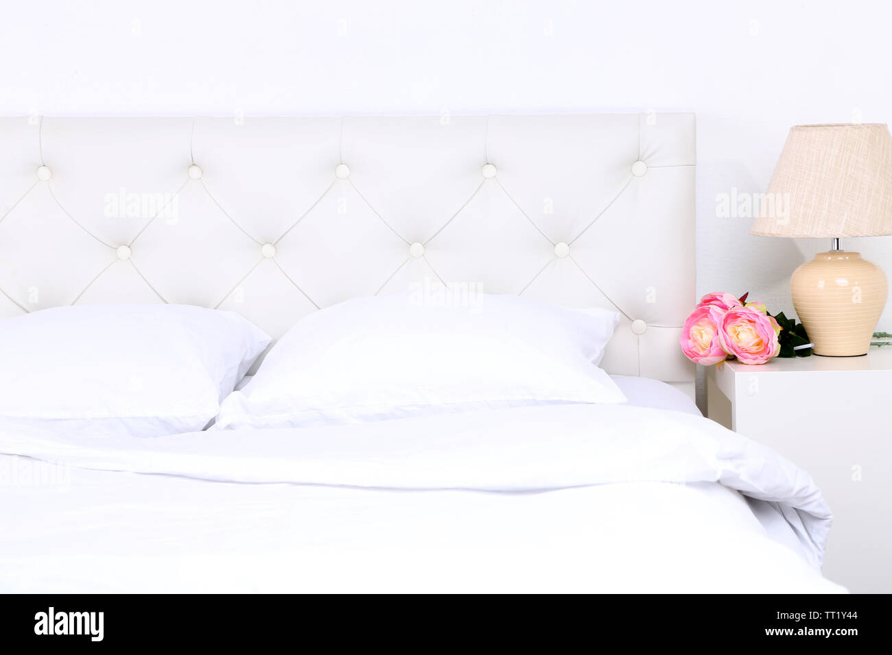 Comfortable soft bed with pillows Stock Photo - Alamy