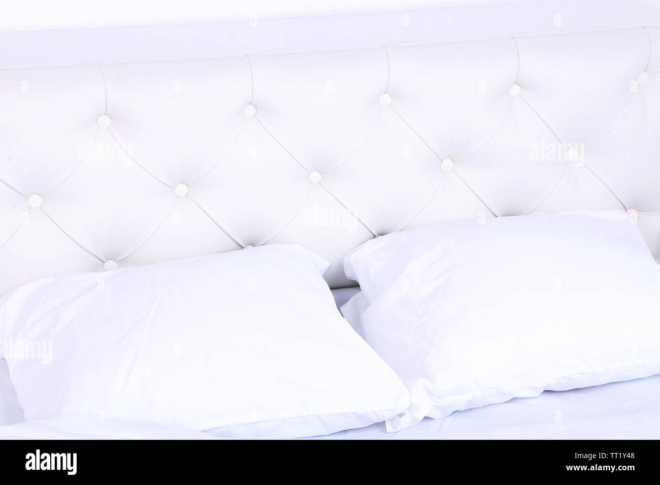 Comfortable soft bed with pillows Stock Photo - Alamy