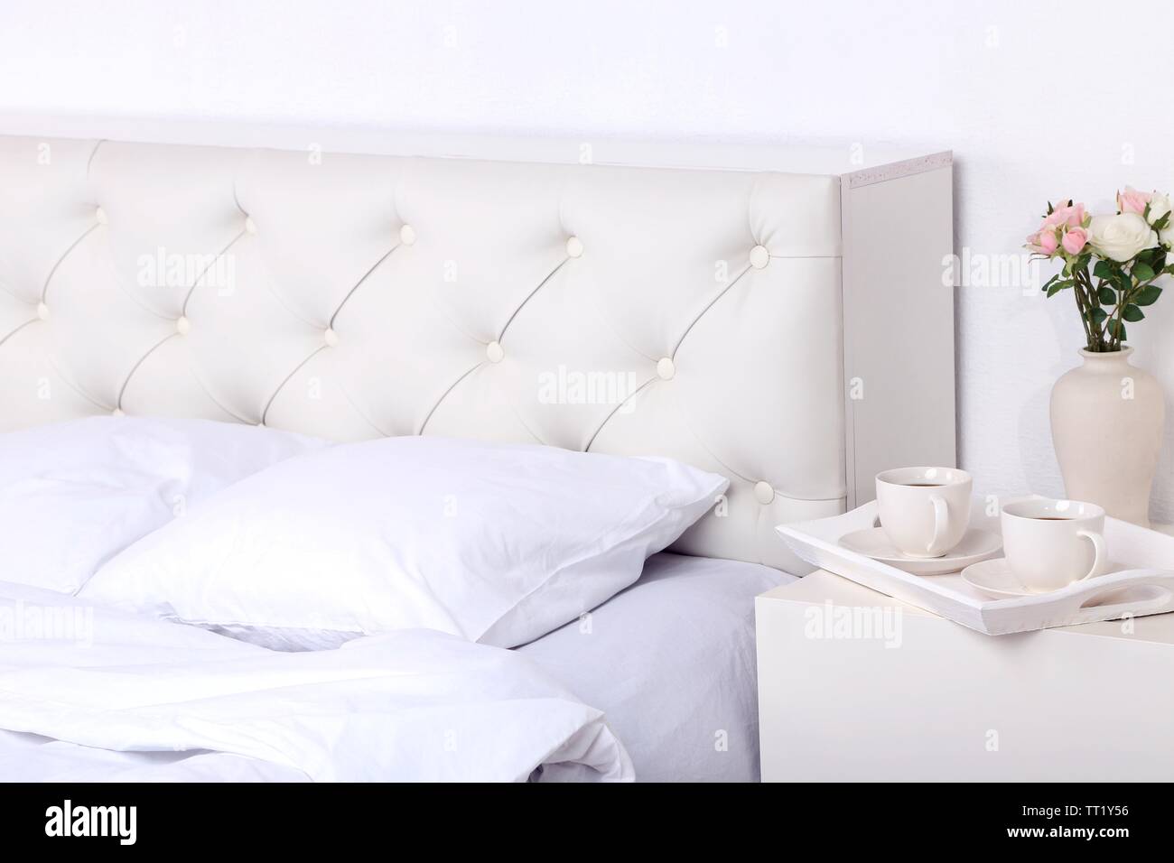 Comfortable soft bed with pillows Stock Photo - Alamy