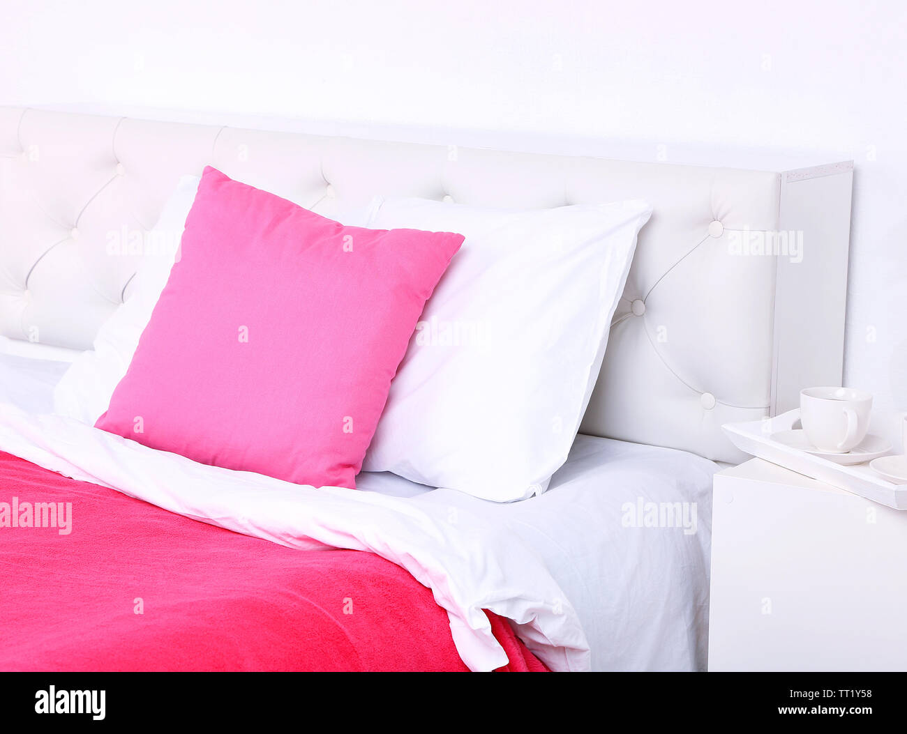 Comfortable soft bed with pillows Stock Photo - Alamy