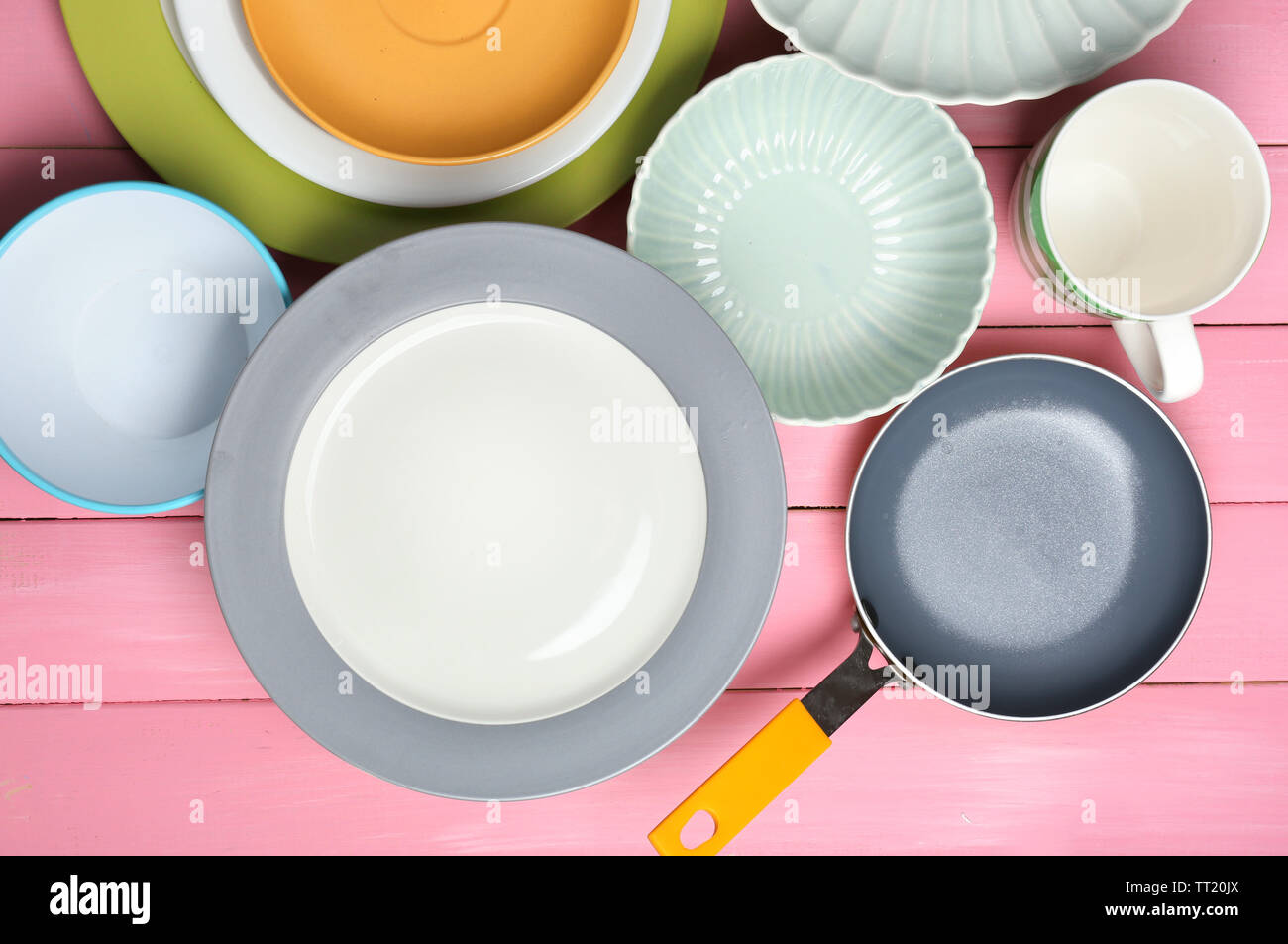 Different tableware on wooden background Stock Photo - Alamy