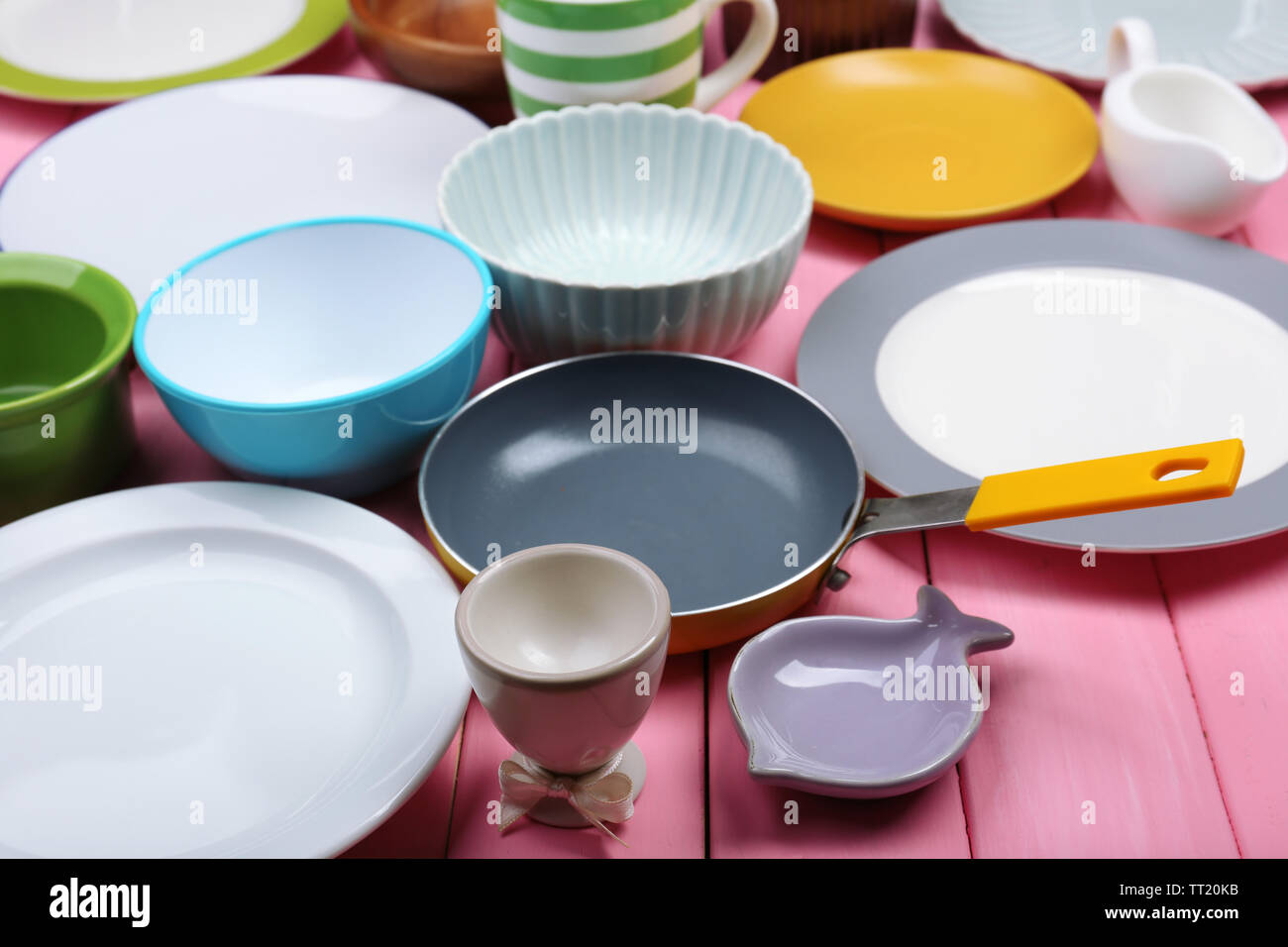 Different tableware on wooden background Stock Photo - Alamy