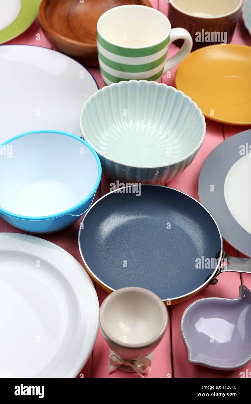 Different tableware on wooden background Stock Photo - Alamy