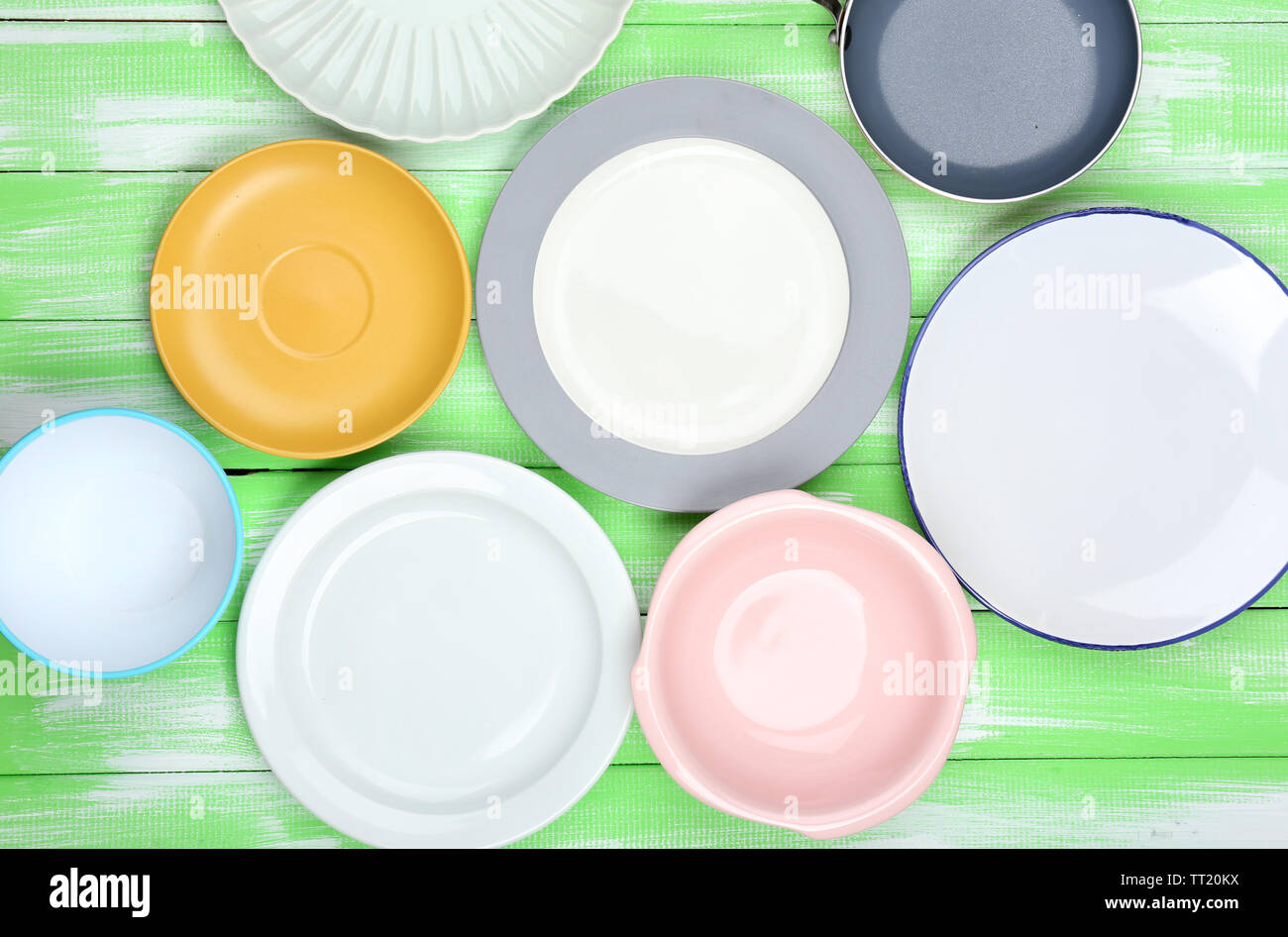 Different tableware on wooden background Stock Photo - Alamy