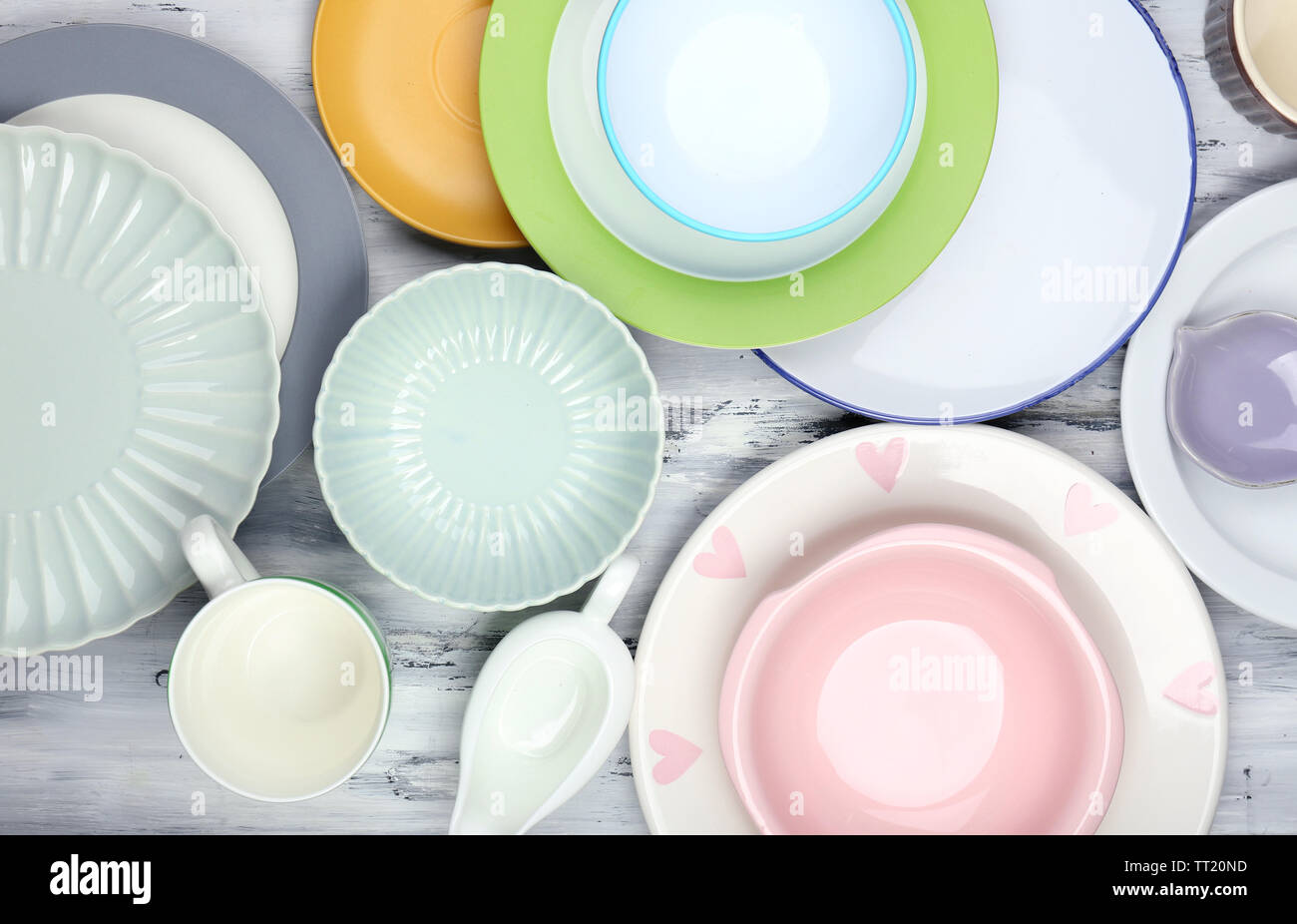 Different tableware on wooden background Stock Photo - Alamy