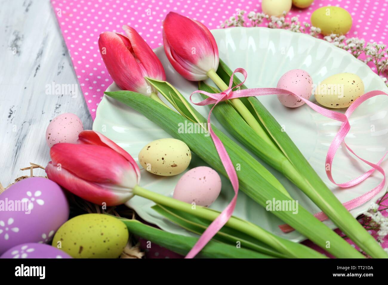 Easter table setting with tulips and eggs Stock Photo - Alamy