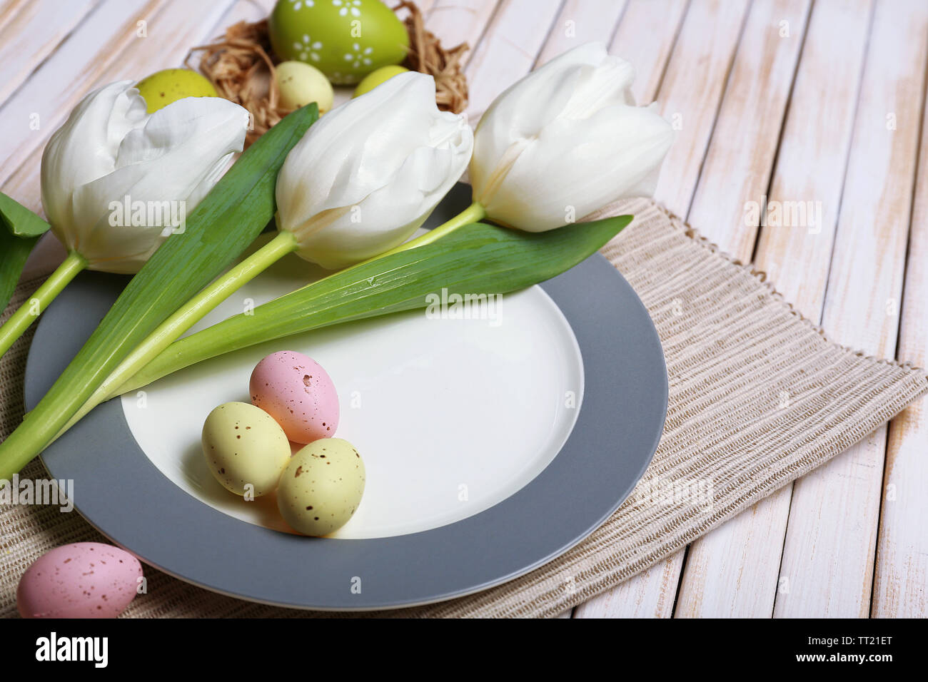 Easter table setting with tulips and eggs Stock Photo - Alamy