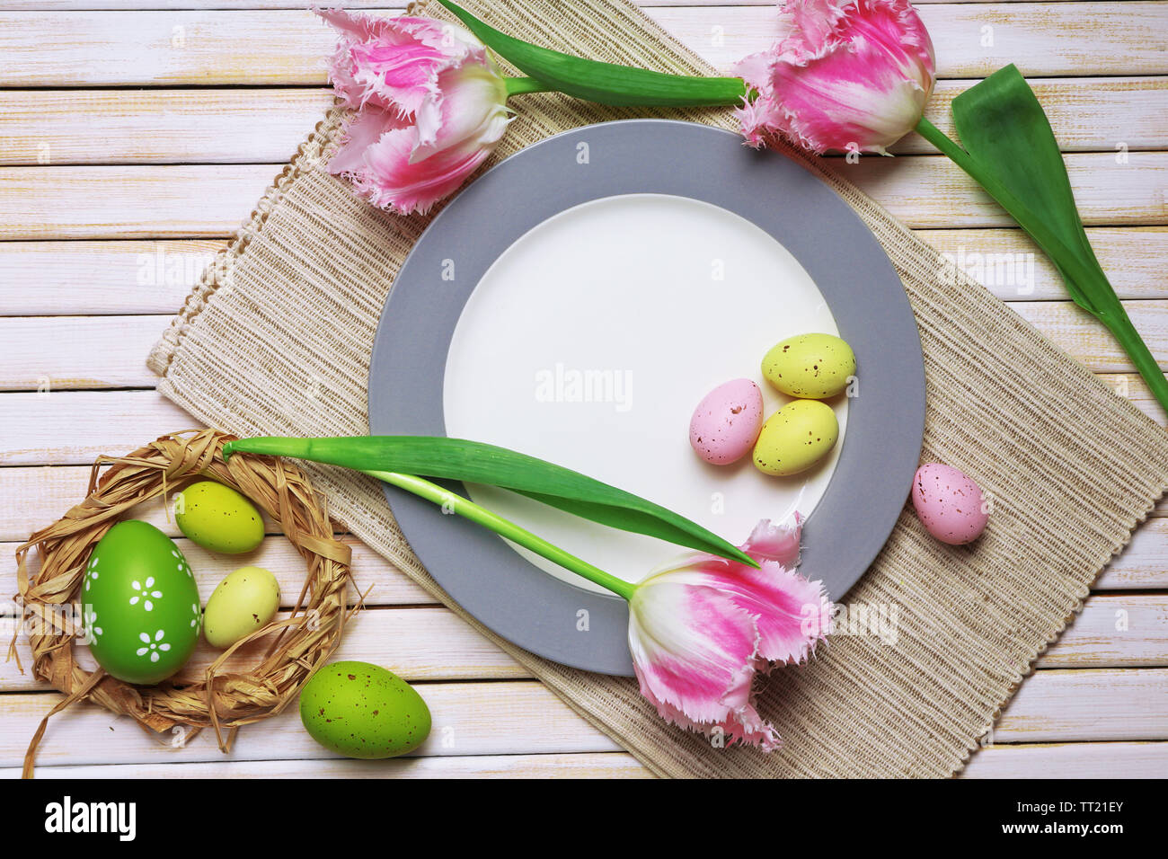 Easter table setting with tulips and eggs Stock Photo - Alamy