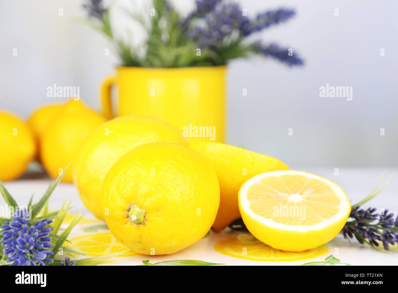Still life with fresh lemons and lavender on light background Stock ...