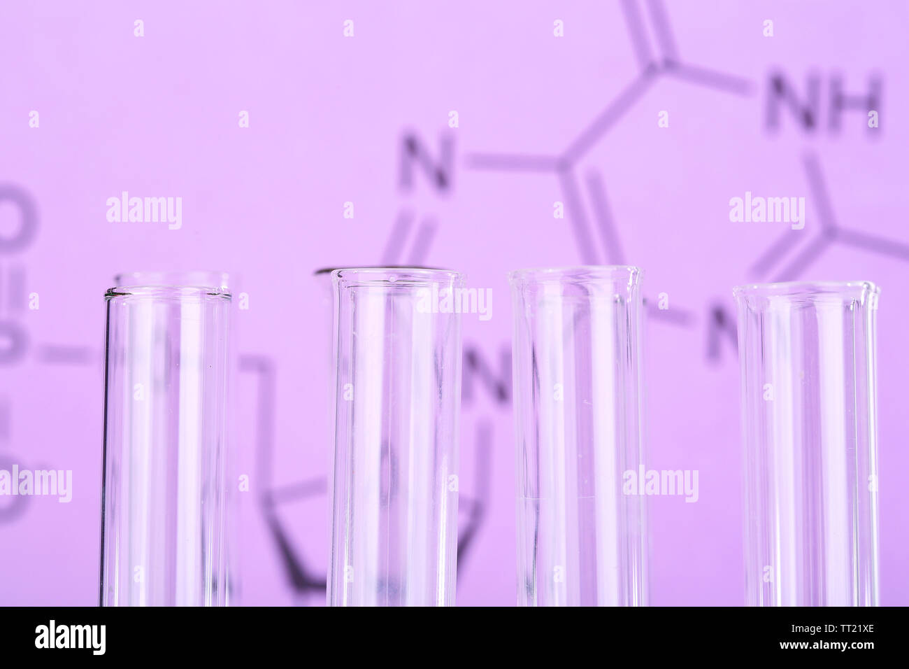 Test tube on written reaction formula background, close-up Stock Photo ...