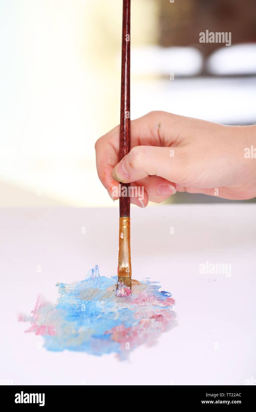 Artist paints picture close-up Stock Photo - Alamy