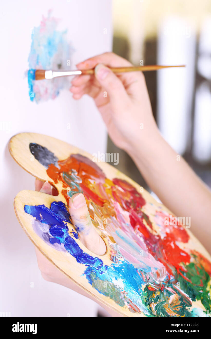 Artist paints picture close-up Stock Photo - Alamy