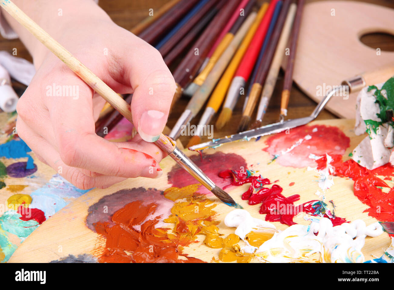 Artist paints picture close-up Stock Photo - Alamy