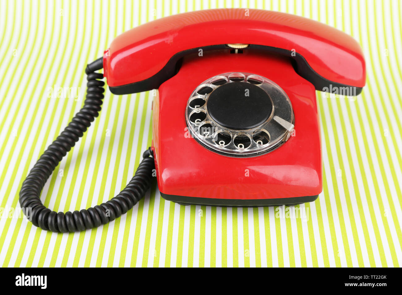 Red retro telephone on bright background Stock Photo - Alamy