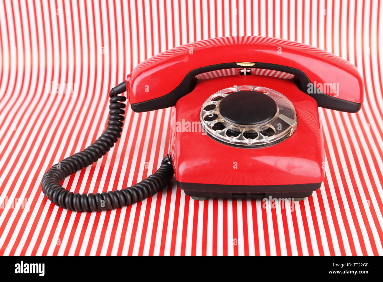 Red retro telephone on bright background Stock Photo - Alamy
