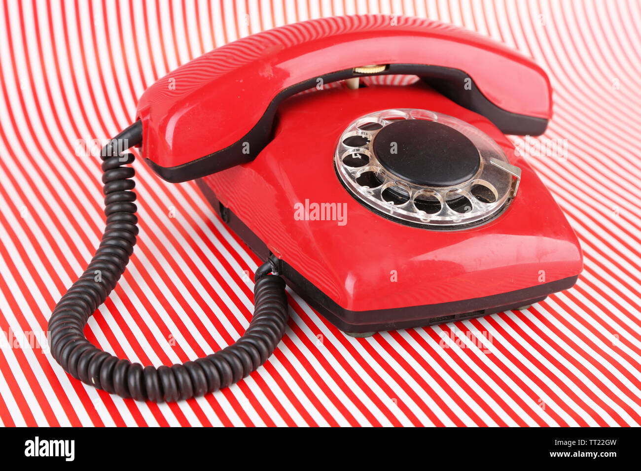 Red retro telephone on bright background Stock Photo - Alamy