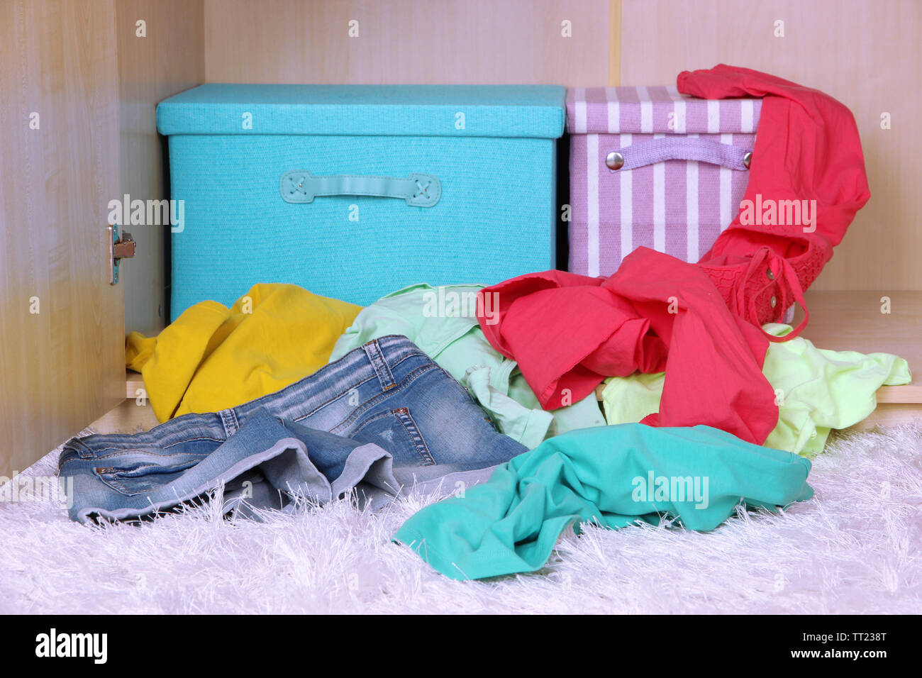 Female clothes lying on floor in room Stock Photo - Alamy