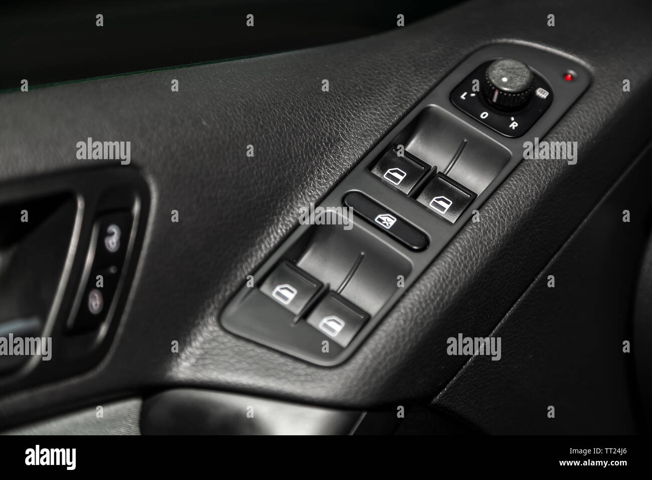 Сlose-up of the car black interior. Side door buttons: window ...