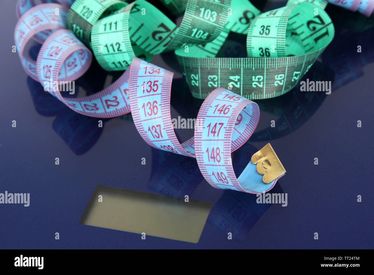 Measuring tape and scales close-up Stock Photo - Alamy